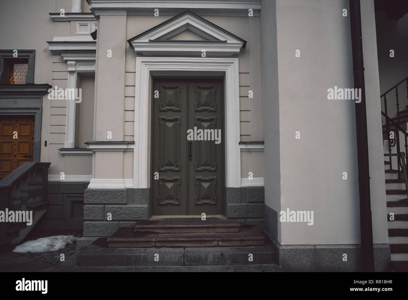 Old fashioned doors in classic style on old building facade background ...