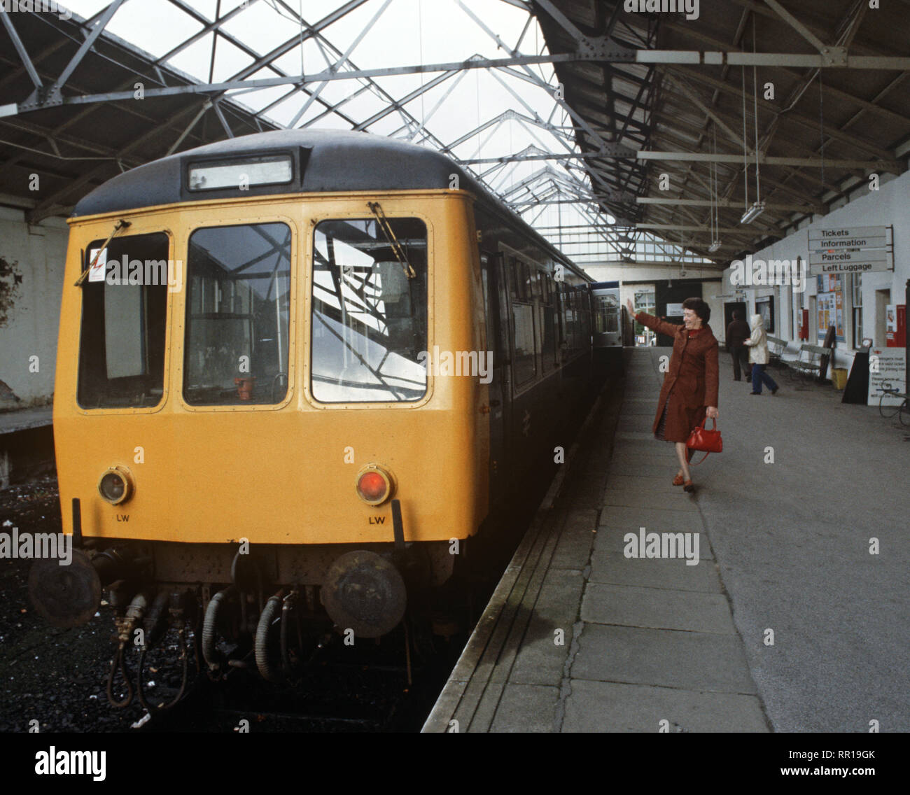 Passenger waiving goodbye in British Rail Windermere railway station on ...