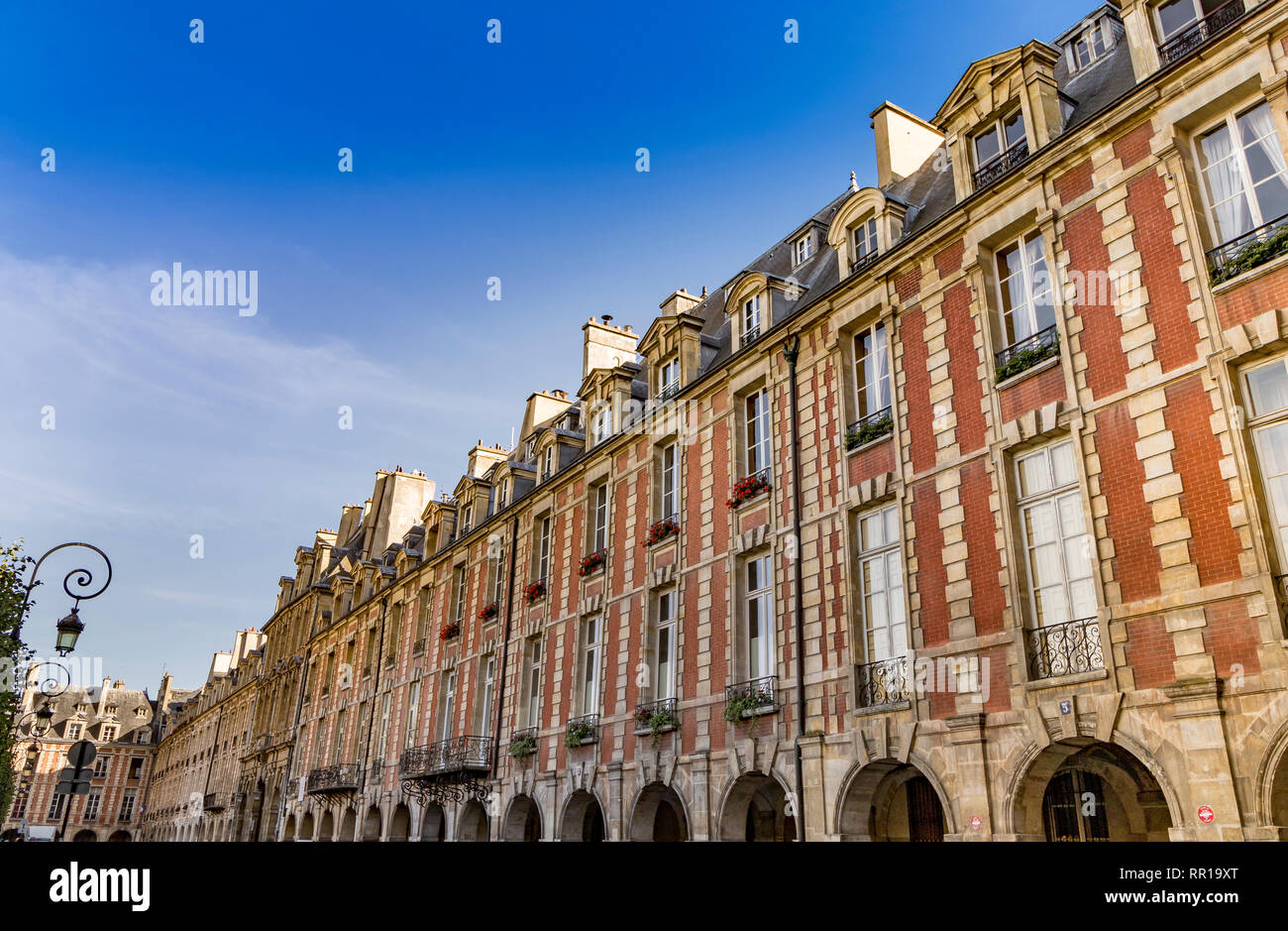 The uniformed and harmonious red brick facades of the buildings ...