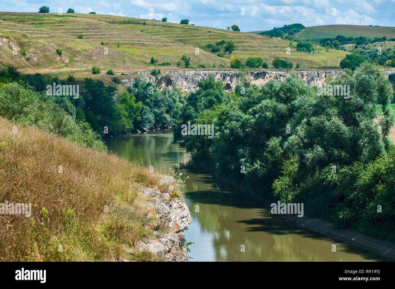 Countryside natural panoramic landscape with river and hills on clear ...