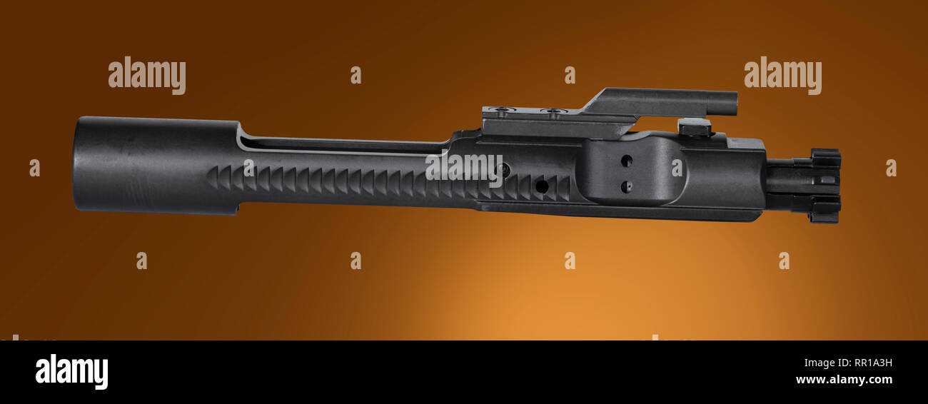 Assault rifle bolt carrier group on a beige background Stock Photo - Alamy