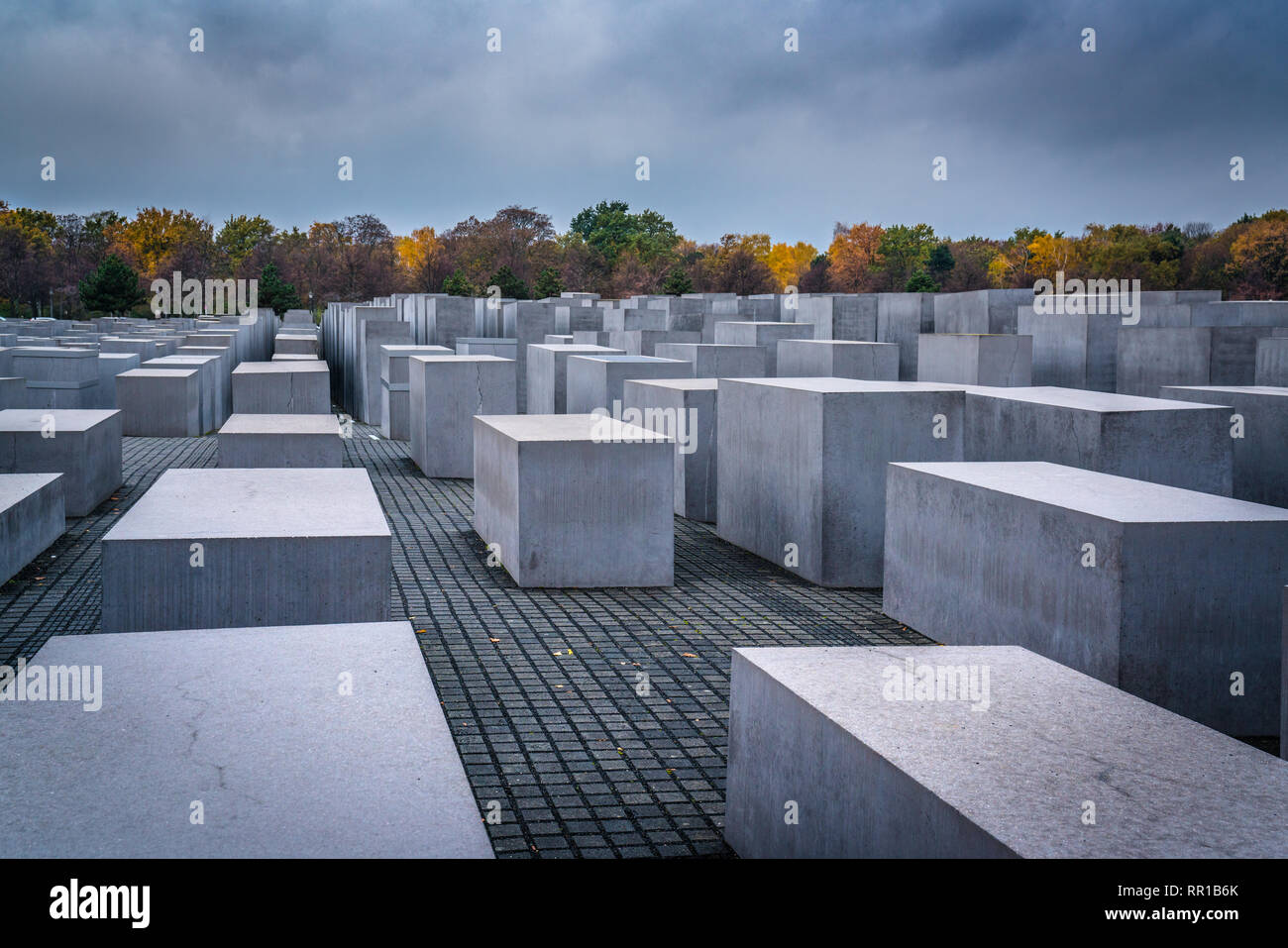 Jewish Memorial made of concrete blocks with fall colors on the trees ...
