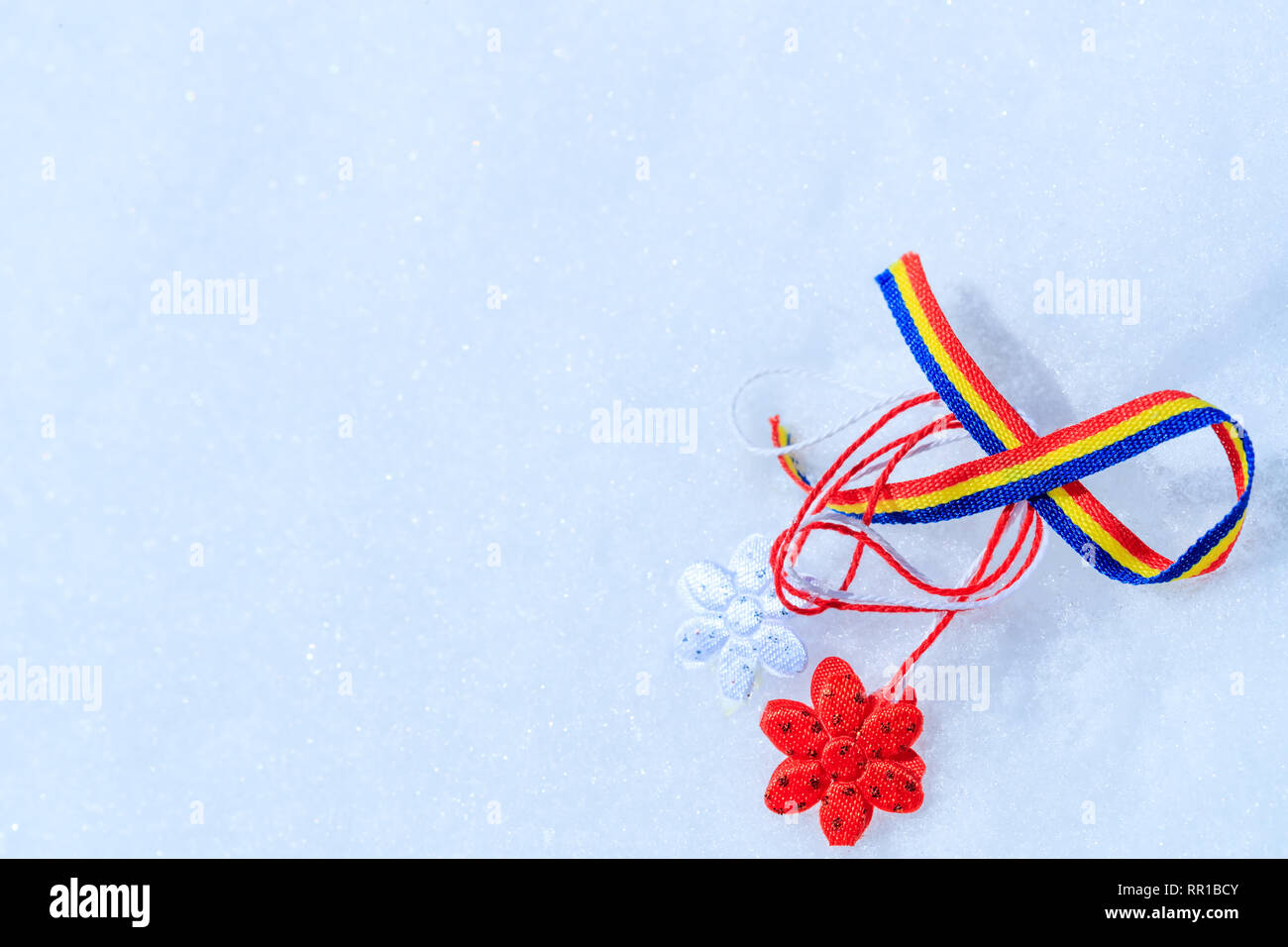 Picture with martisor and romanian tricolor elements on snow white ...