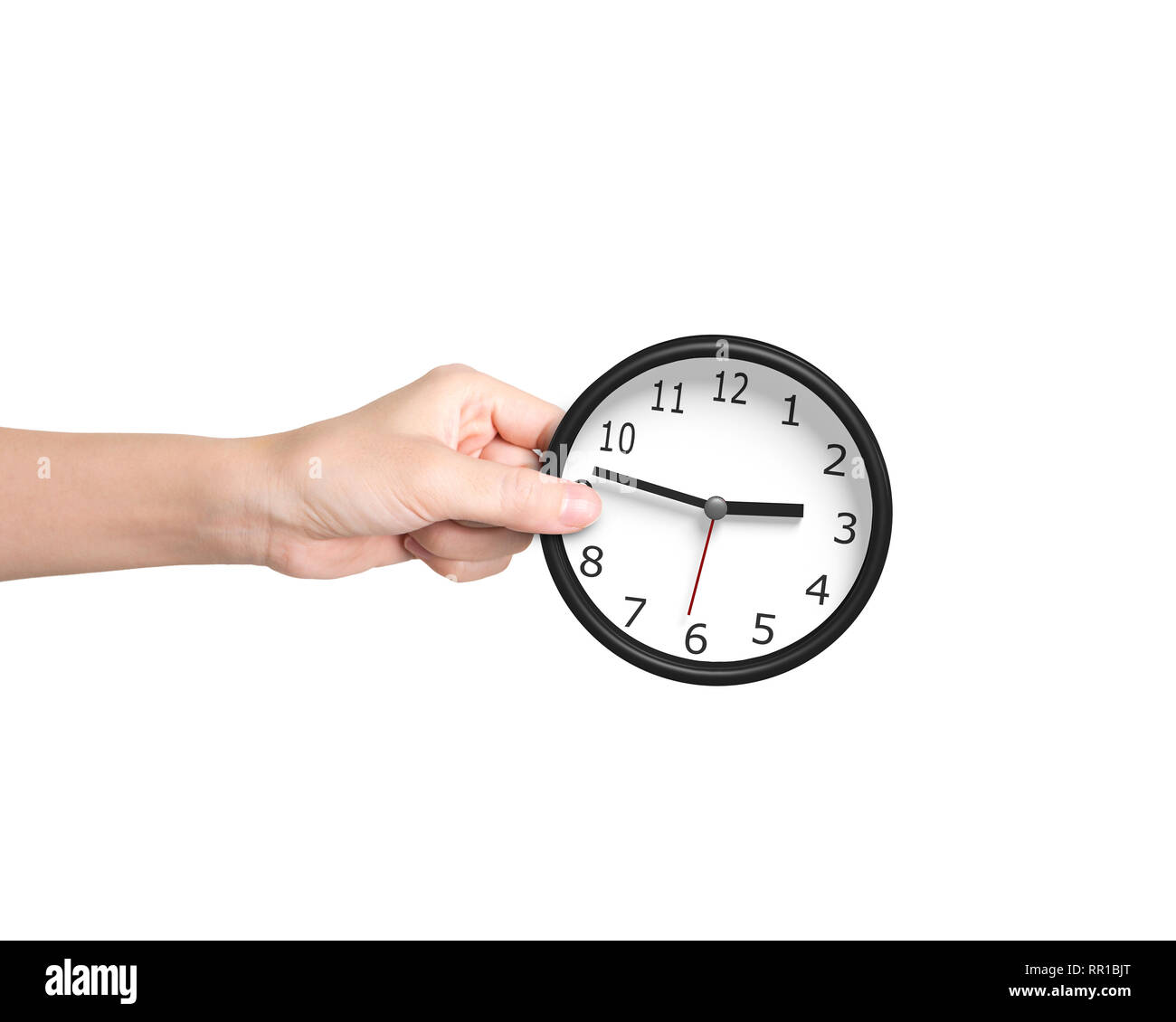 Hand putting a black-white clock, isolated on white background. Time is ...