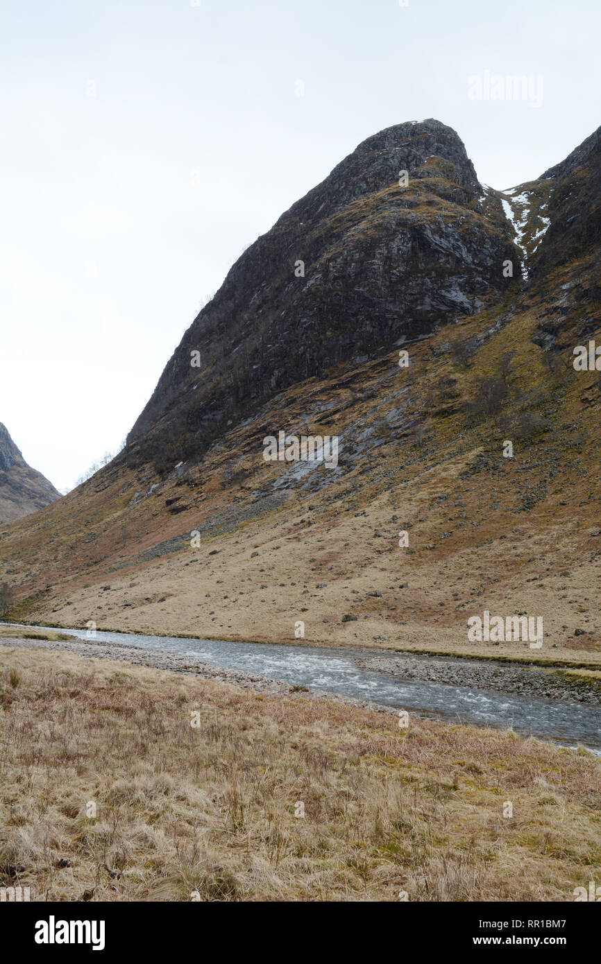 The River Etive flowing beneath the mountains of the Glen Etive valley ...