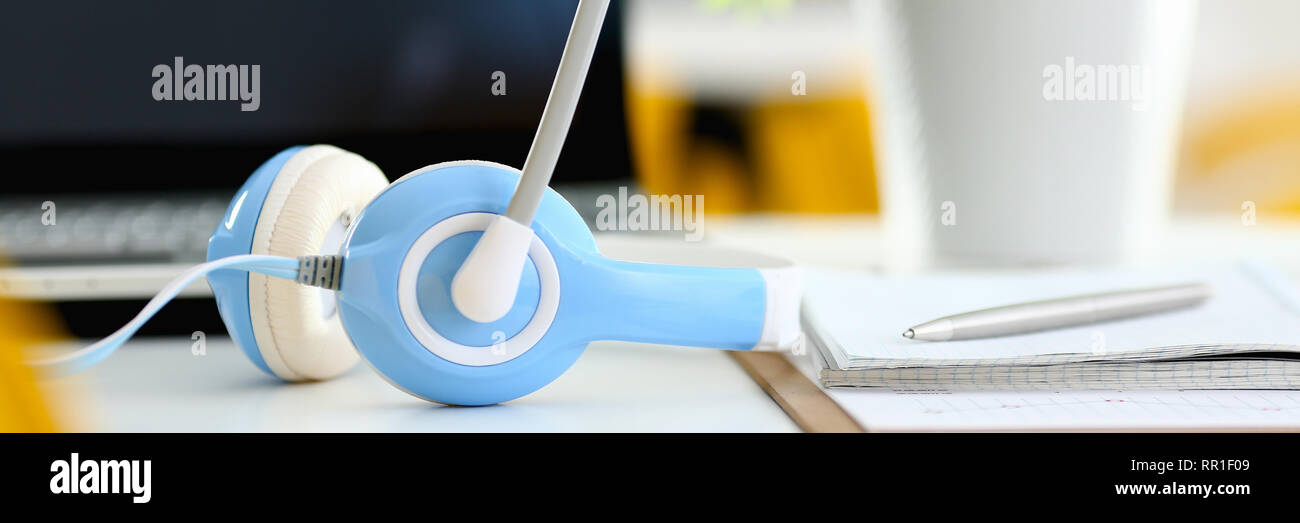 Empty remote office workplace with laptop and headset Stock Photo - Alamy
