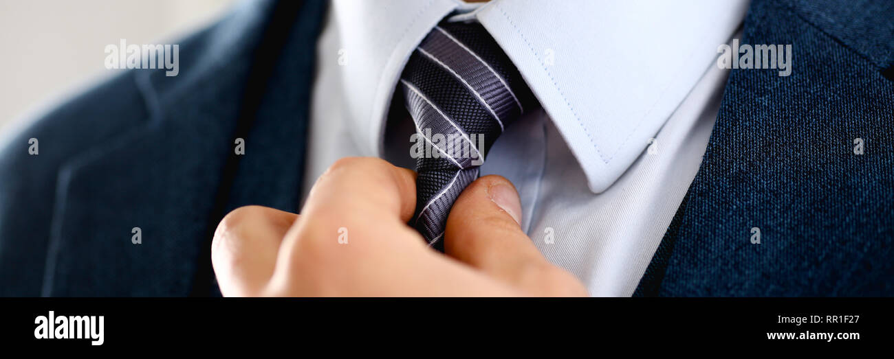 Male arm in blue suit set tie closeup Stock Photo - Alamy