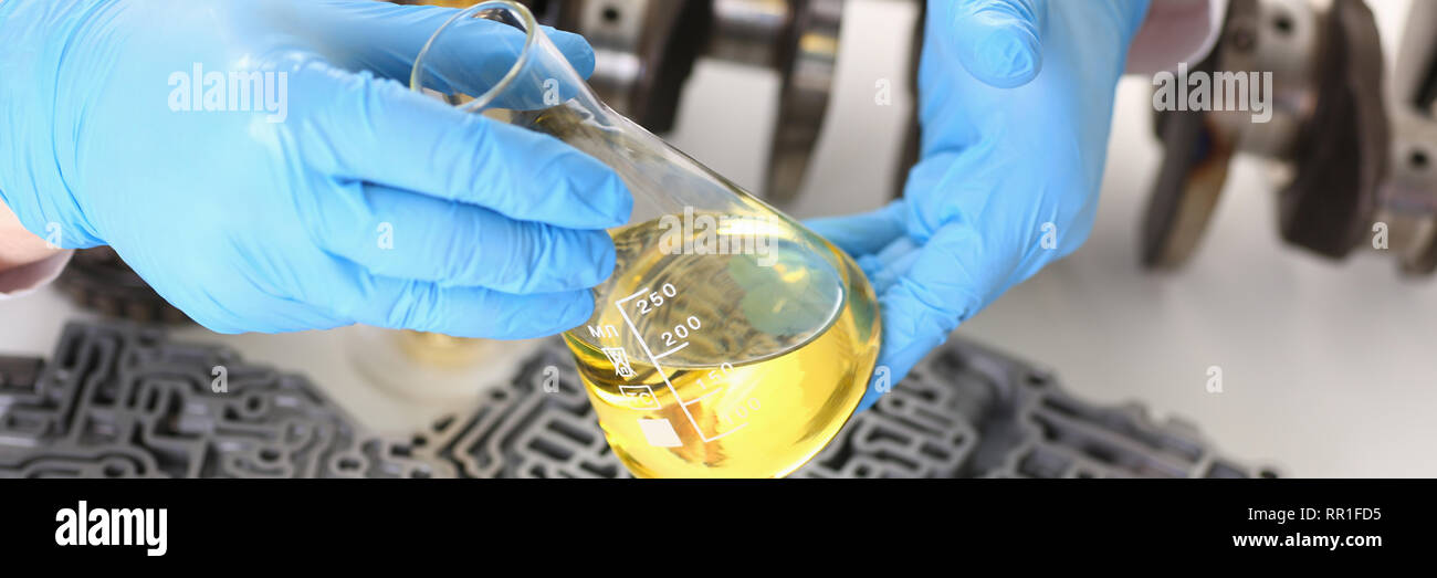 Male hands in protective gloves hold test tube Stock Photo - Alamy