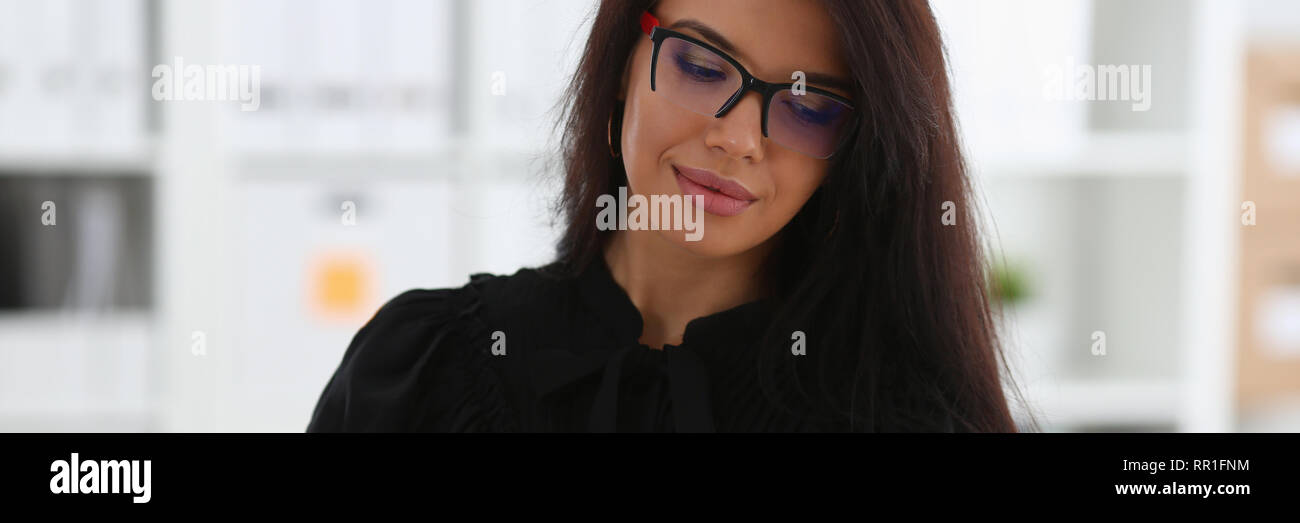Beautiful smiling brunette woman hold in arms red binder Stock Photo ...