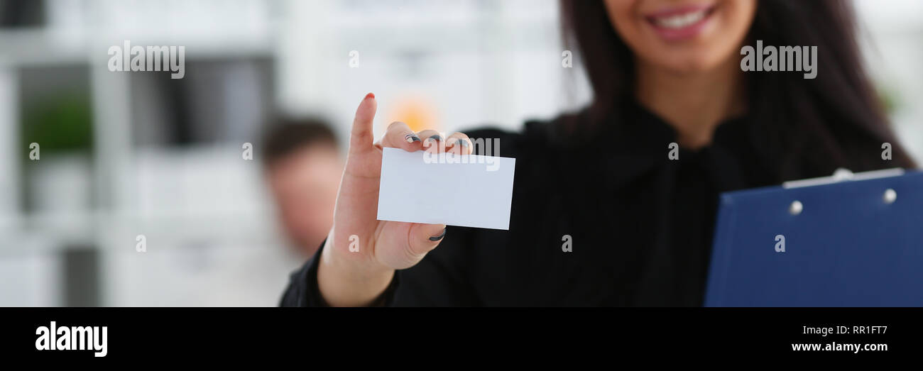 Female arm give blank calling card to visitor Stock Photo - Alamy