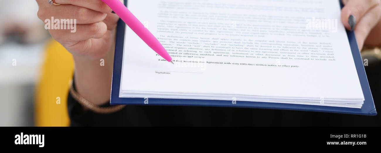 Female arm offer contract form on clipboard pad Stock Photo - Alamy