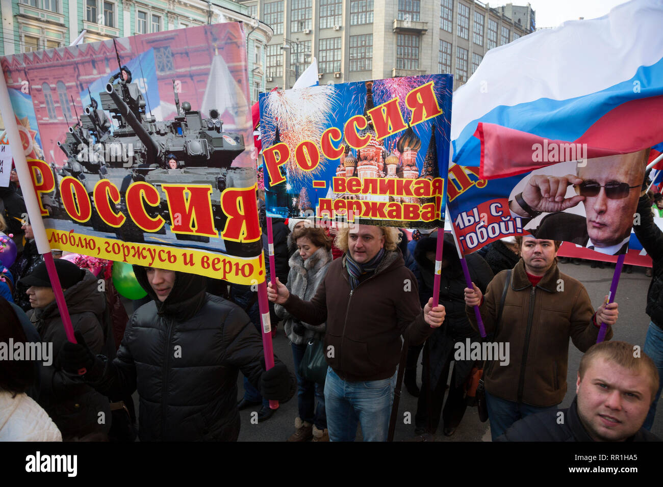 People hold banners on the March "We are United" in the Russian ...