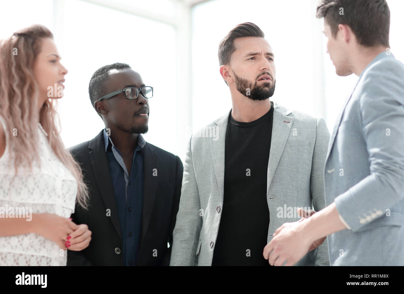 Manager talking with young employees Stock Photo - Alamy