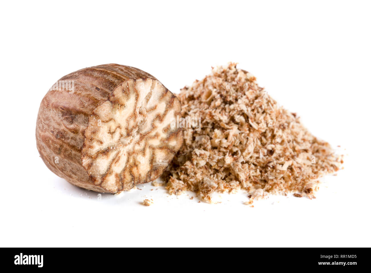one nutmeg and powder isolated on white background Stock Photo - Alamy