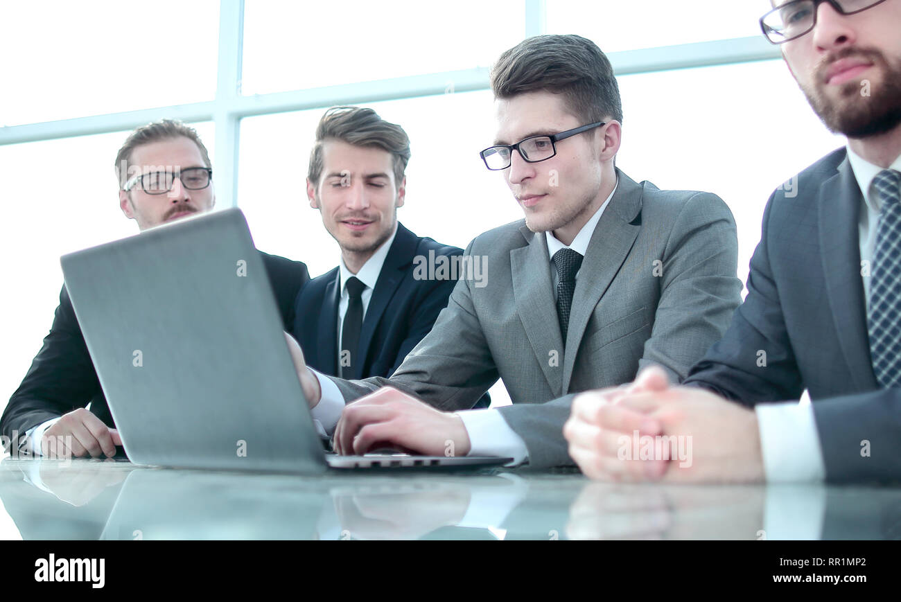 group of business people sitting at an office Desk Stock Photo - Alamy