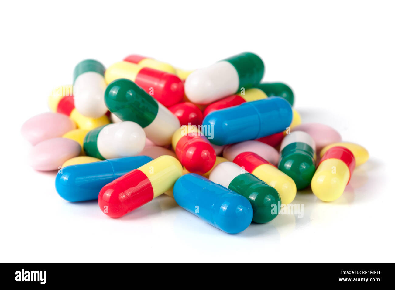 colorful pills isolated on white background Stock Photo - Alamy