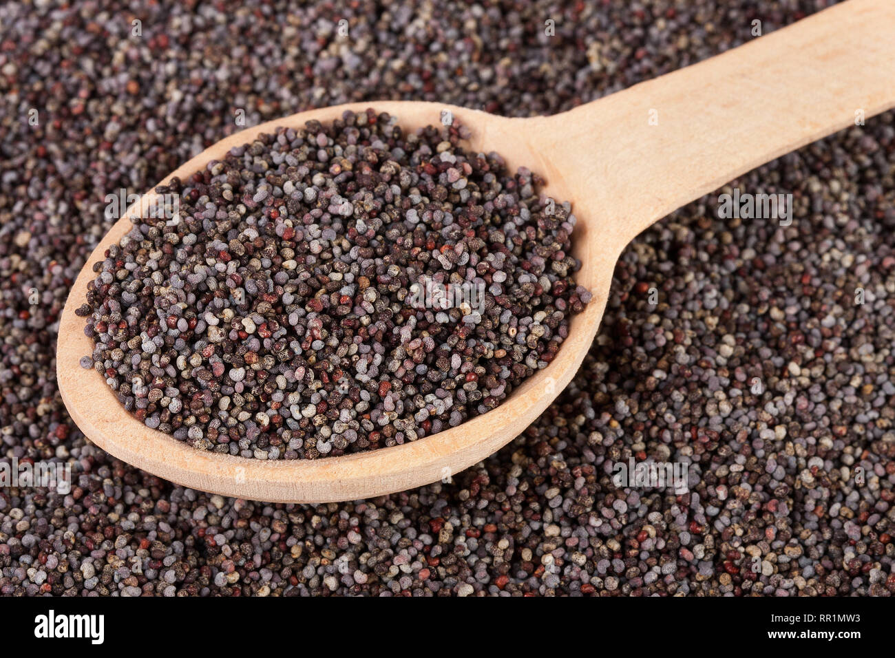 poppy seeds with a spoon as background close-up. Top view Stock Photo ...
