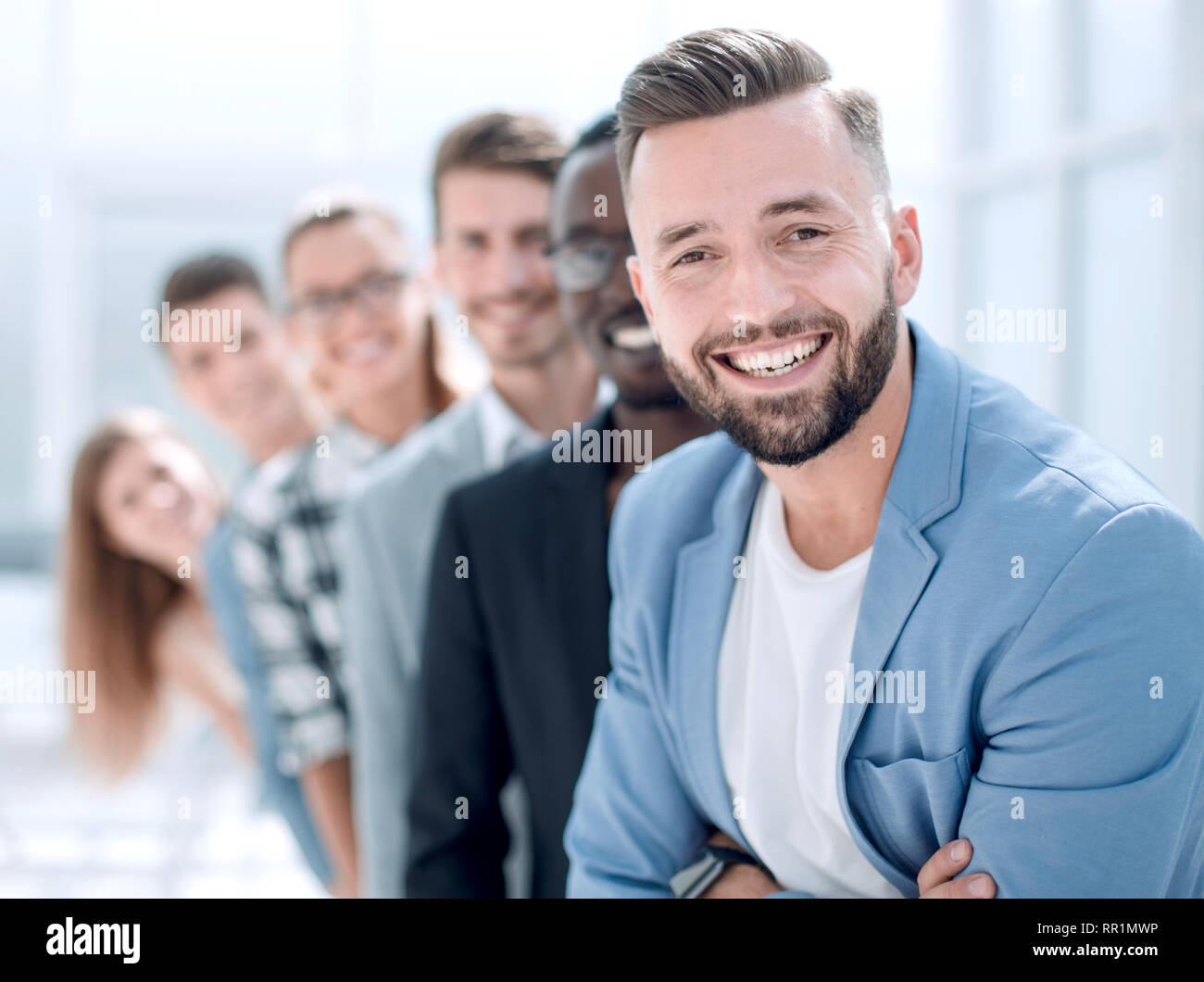 six different people standing in a row Stock Photo - Alamy