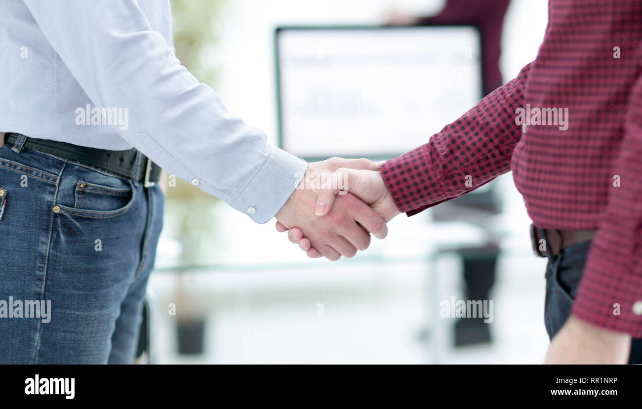Businessmen making handshake in an office Stock Photo - Alamy