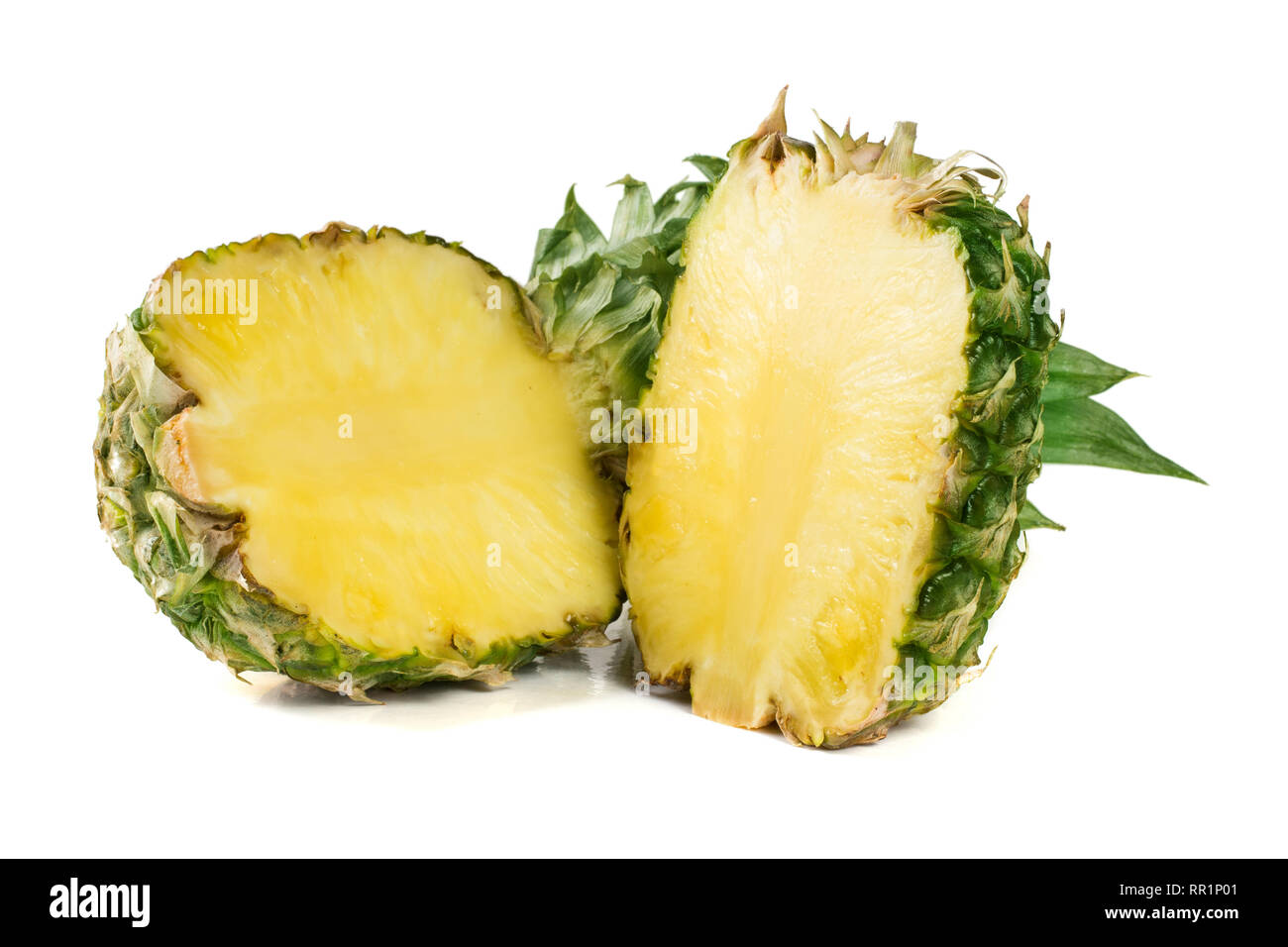 pineapple cut into two halves isolated on a white background Stock ...