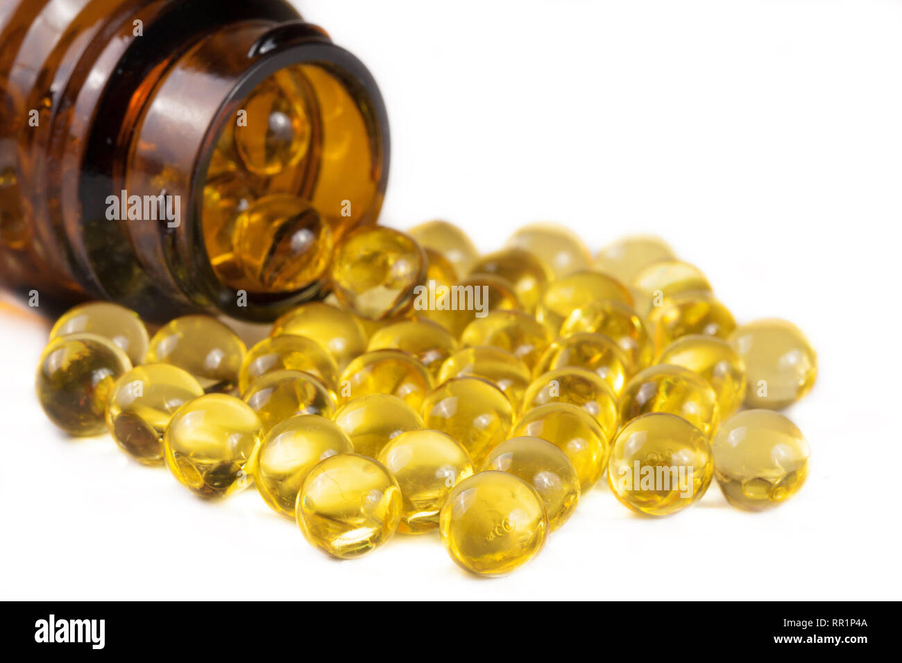 Fish oil capsules in a glass bottle isolated on white background Stock ...
