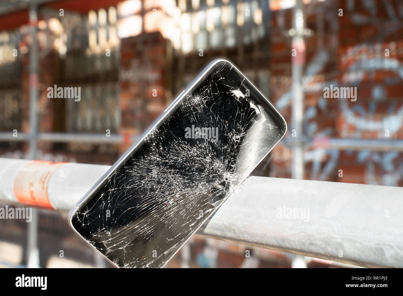Mobile phone falls on the street Stock Photo - Alamy