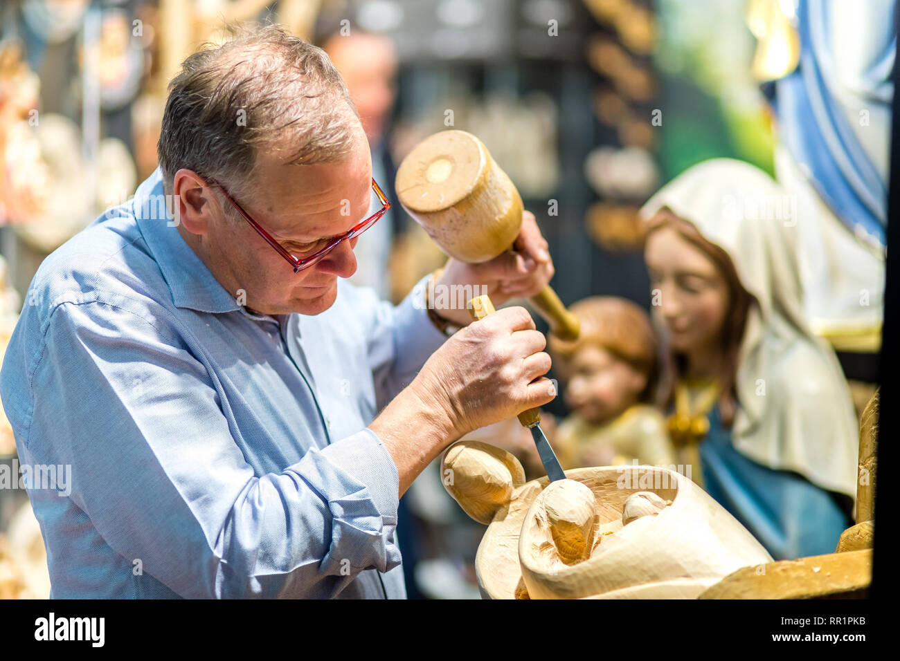 BOLOGNA, ITALY - FEBRUARY 18, 2019: sculptor carving statue at stand of ...