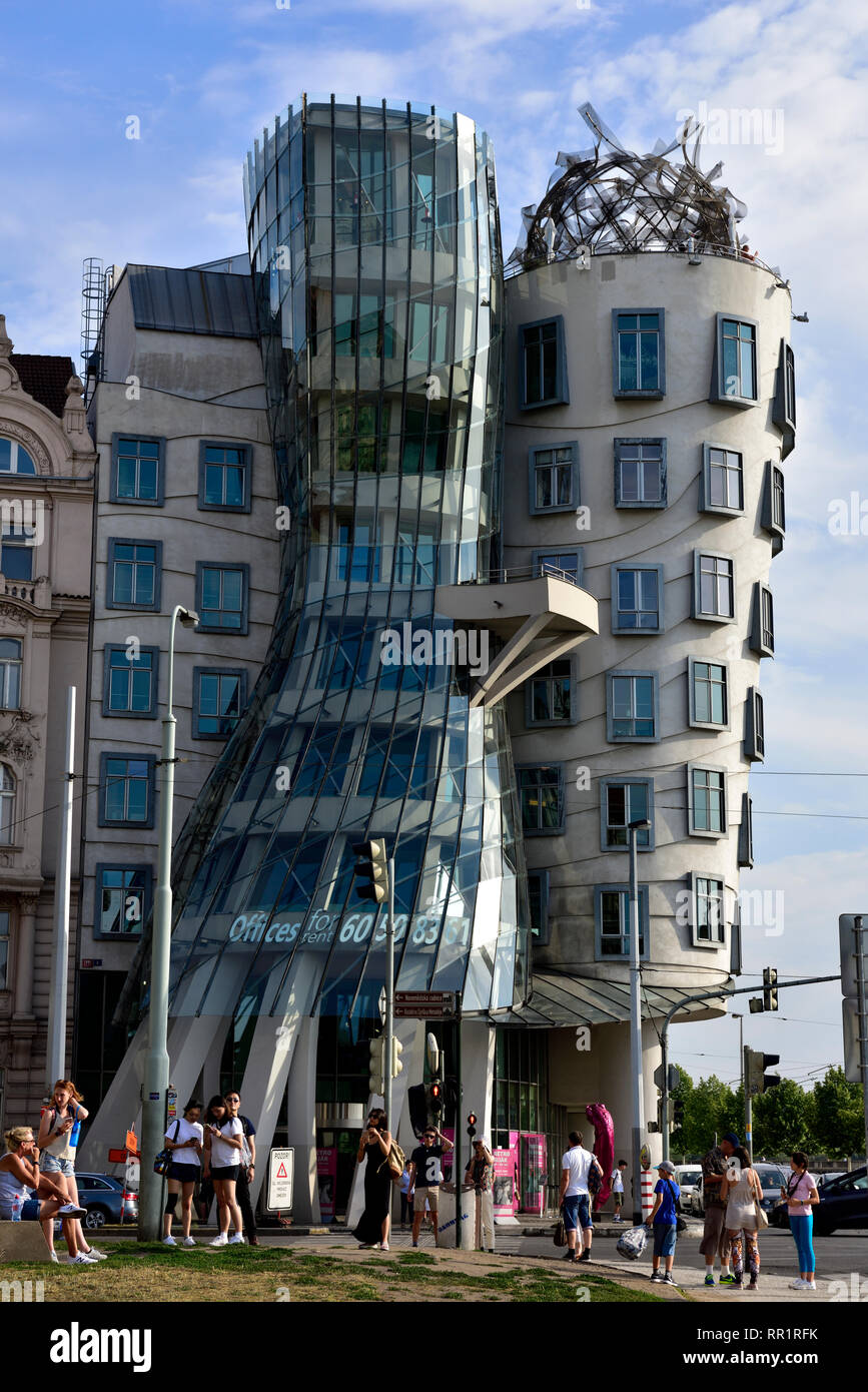 Prague Dancing House building with tourists in park outside Stock Photo ...