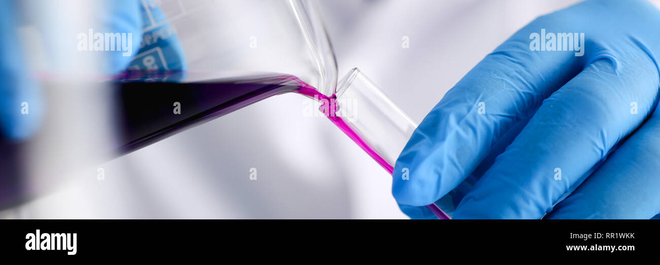 A male chemist holds test tube of glass in Stock Photo - Alamy