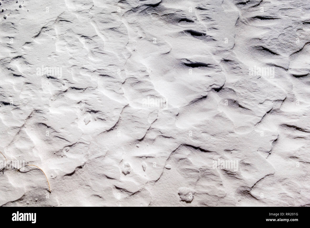Close up of wind sculpted patterns in fresh snow Stock Photo - Alamy