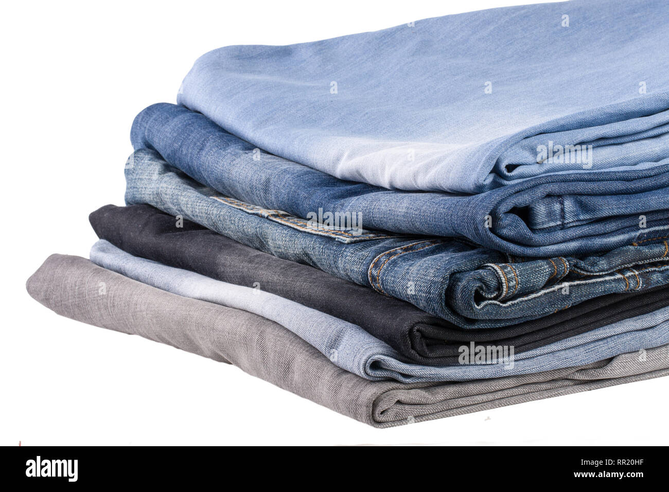 Pile denim jeans isolated on hi-res stock photography and images - Alamy