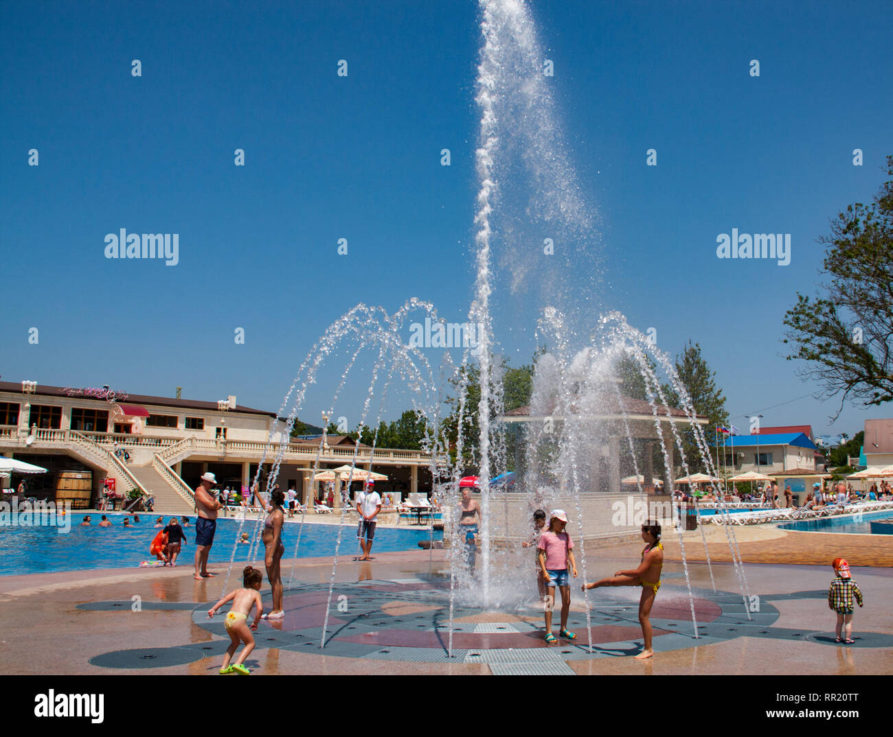 children playing in the fountain in the park Stock Photo - Alamy
