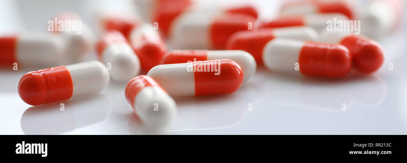 Tablets scattered on the table of the Stock Photo - Alamy