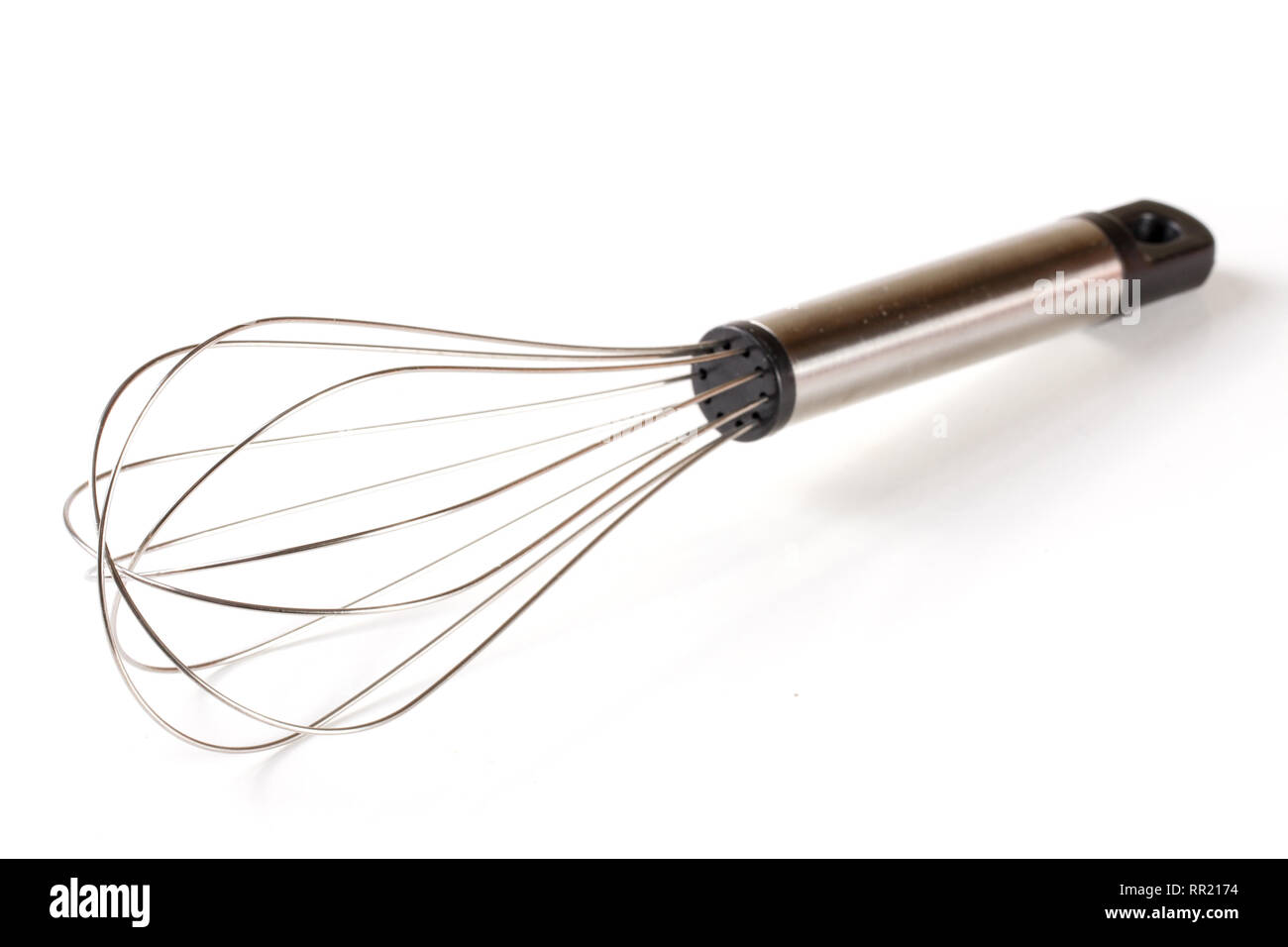 Metal whisk for whipping isolated on white background Stock Photo - Alamy