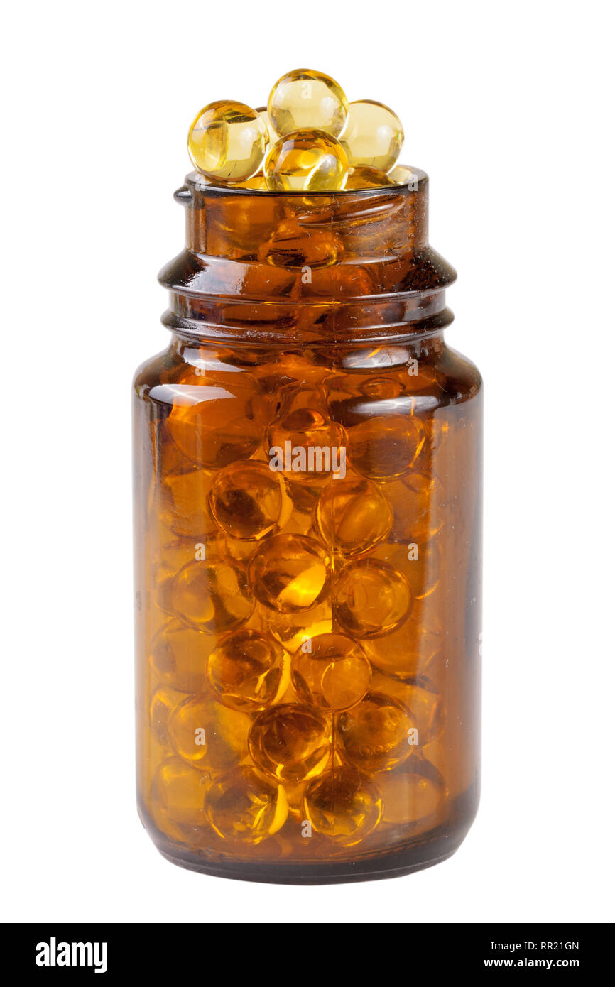 Fish oil capsules in a glass bottle isolated on white background Stock ...