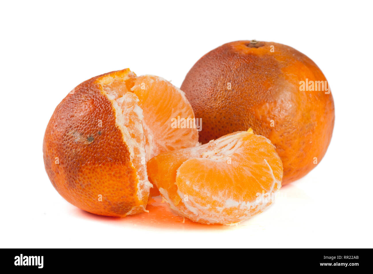 two damaged tangerines isolated on white background Stock Photo - Alamy