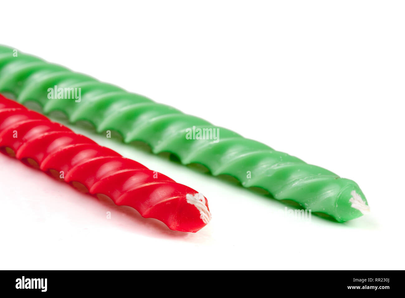 red and green candle isolated on white background Stock Photo - Alamy