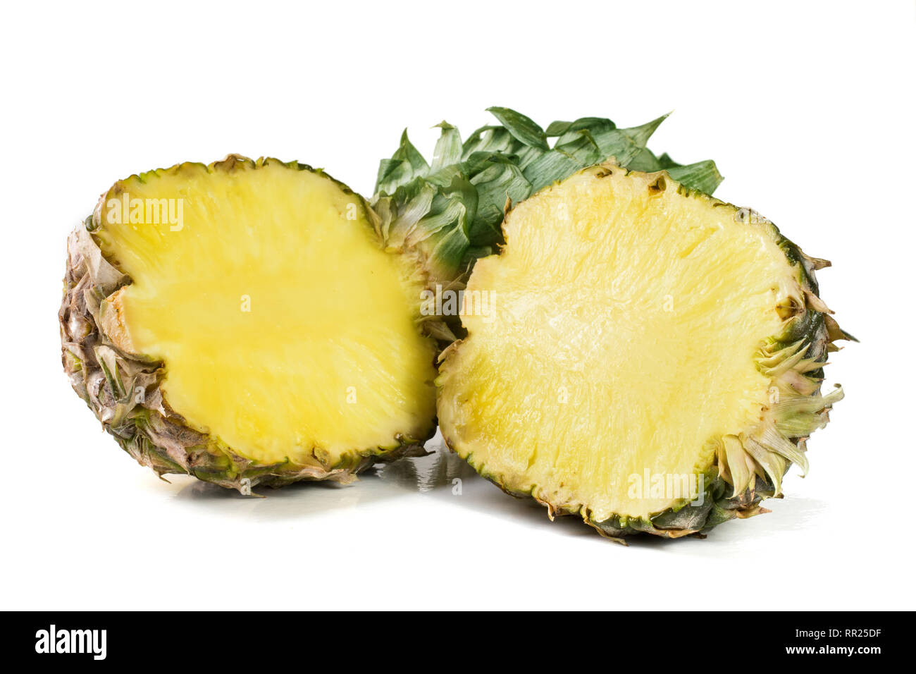 pineapple cut into two halves isolated on a white background Stock ...