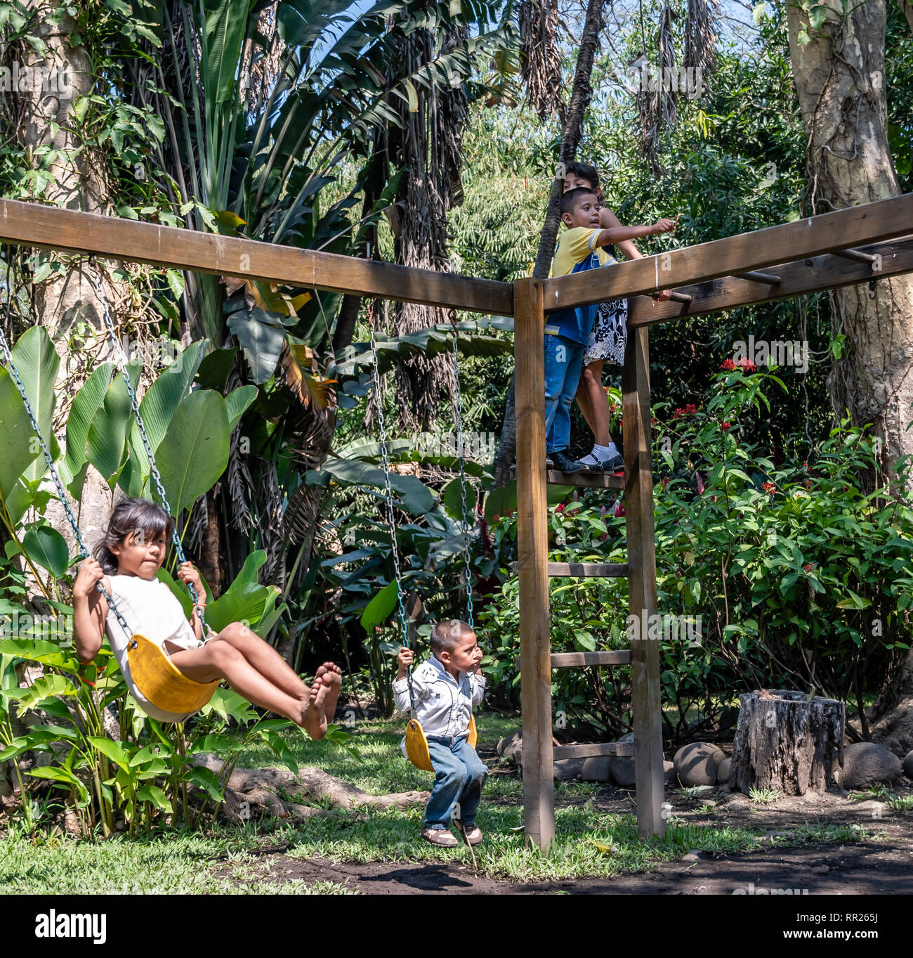 latin family playing on playground in Guatemala Stock Photo - Alamy