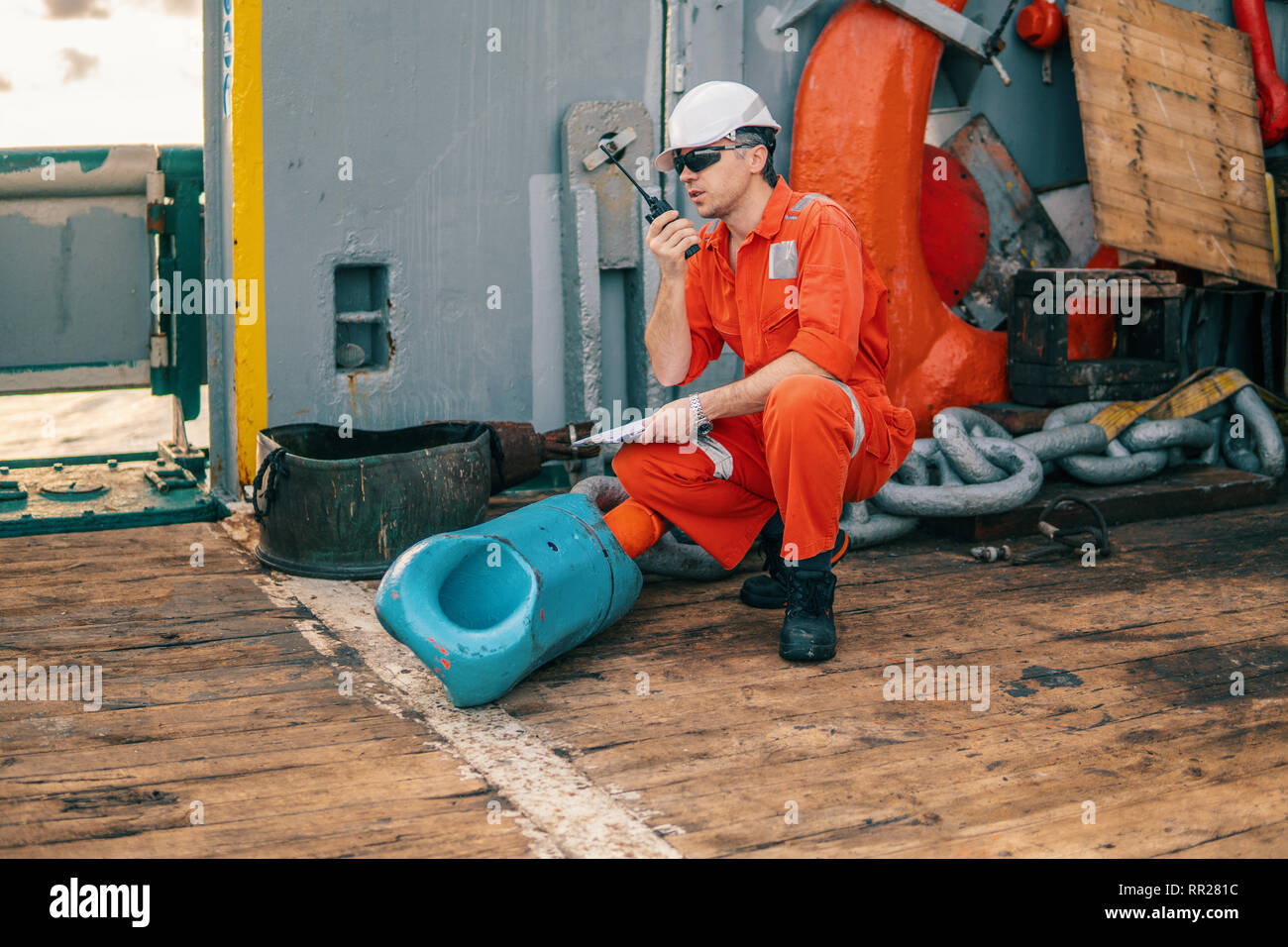 chief officer on deck of ship or vessel with checklist Stock Photo - Alamy