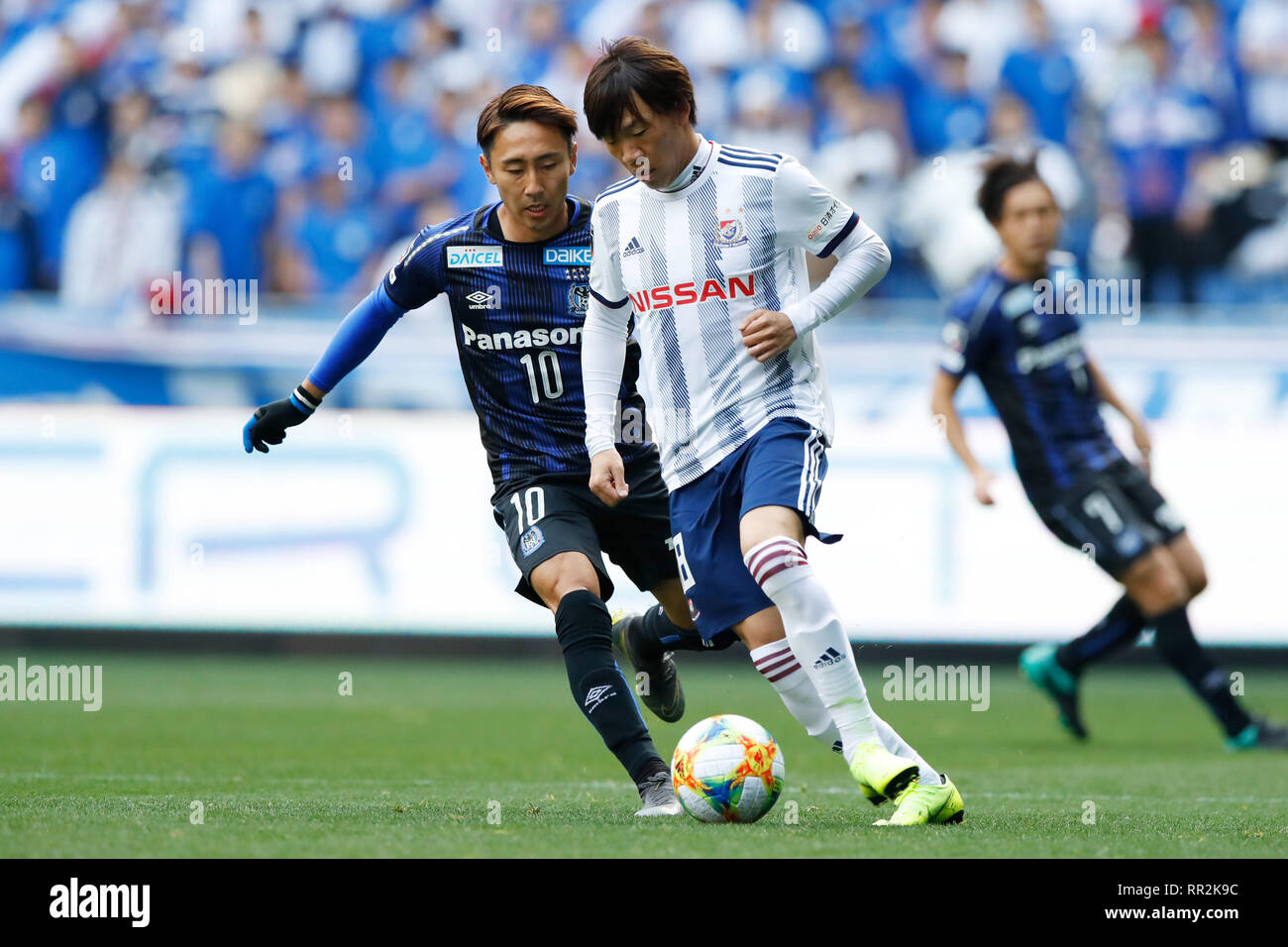 Osaka, Japan. 23rd Feb, 2019. (L to R) Shu Kurata (Gamba), ? Rikuto Hirose (FMarinos) Football ...