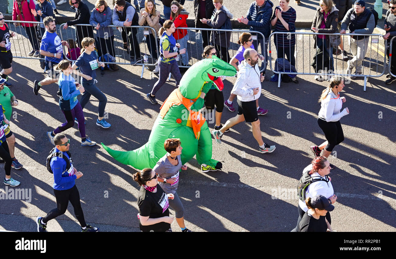 Brighton, UK. 24th Feb, 2019. A runner in a dinosaur costume taking ...
