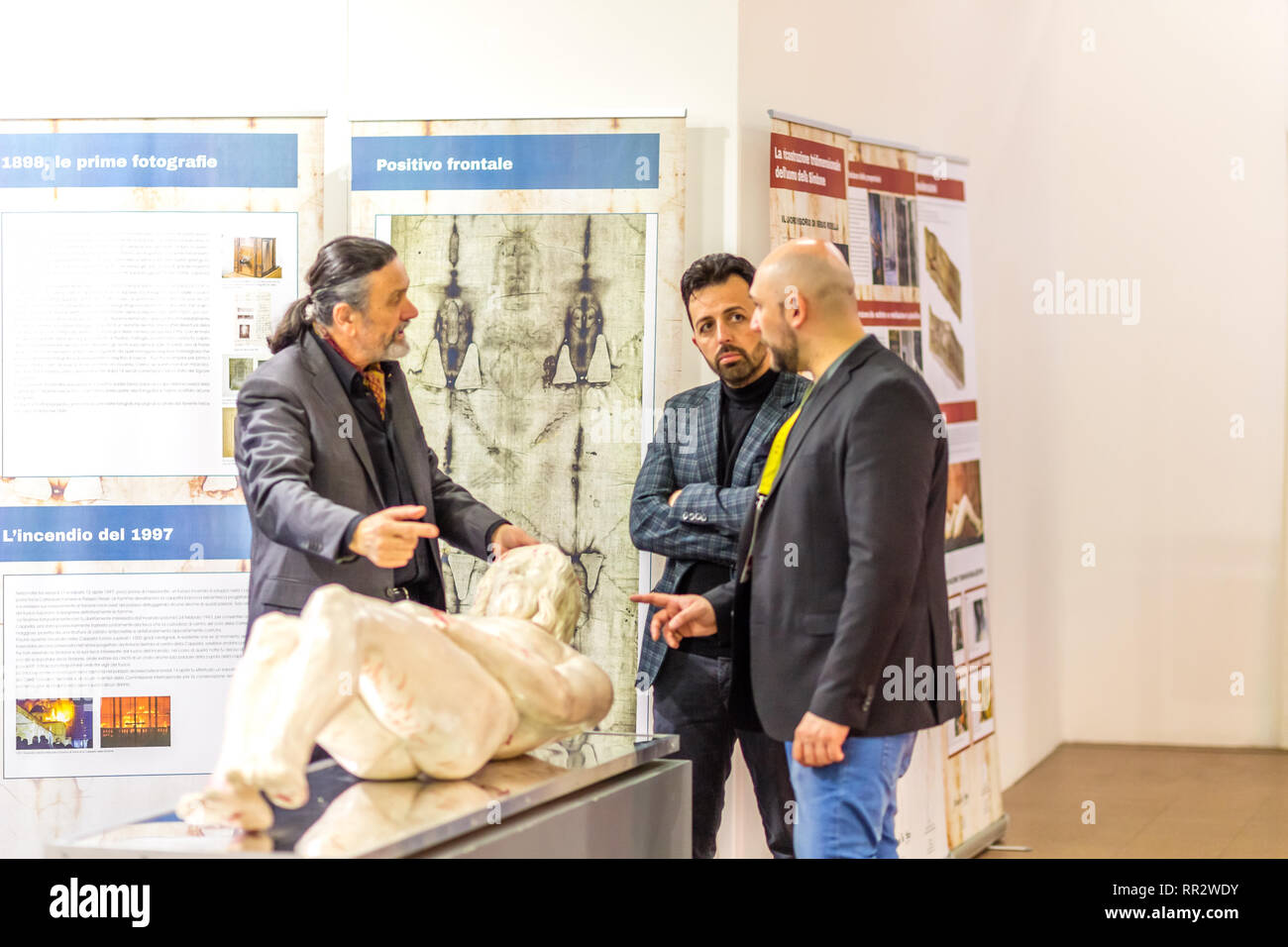 BOLOGNA, ITALY - FEBRUARY 18, 2019: booth presenter talking with ...