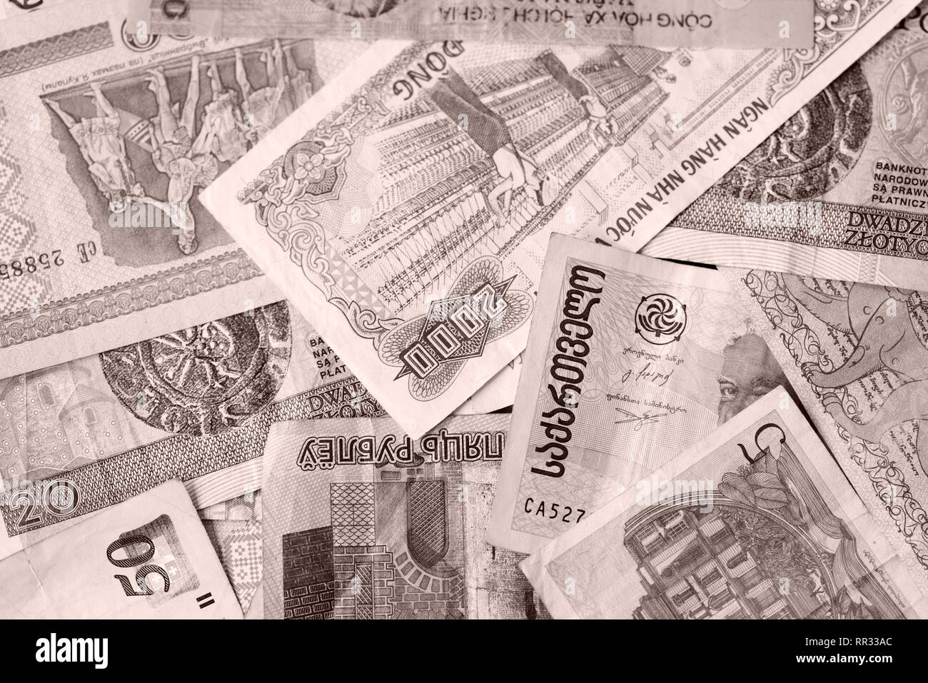 Different countries money background close up. Brown color toned Stock ...