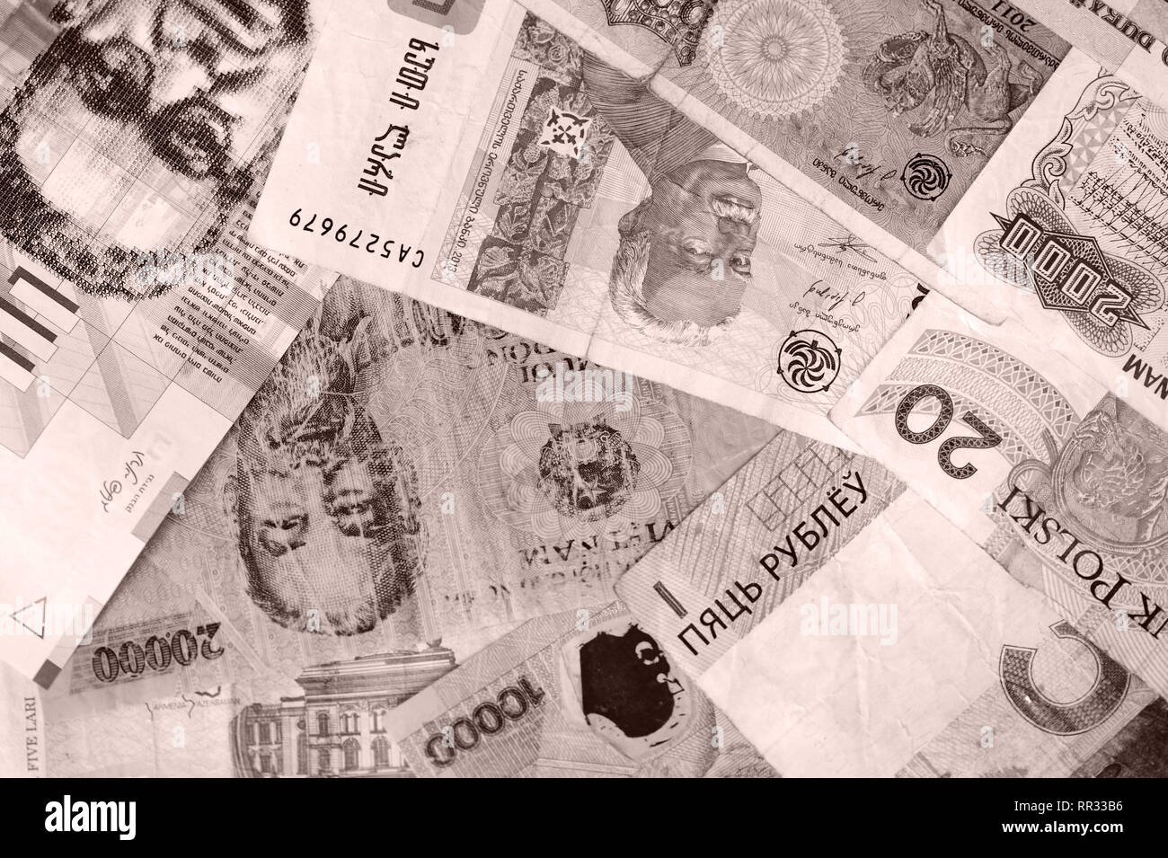 Different countries money background close up. Brown color toned Stock ...