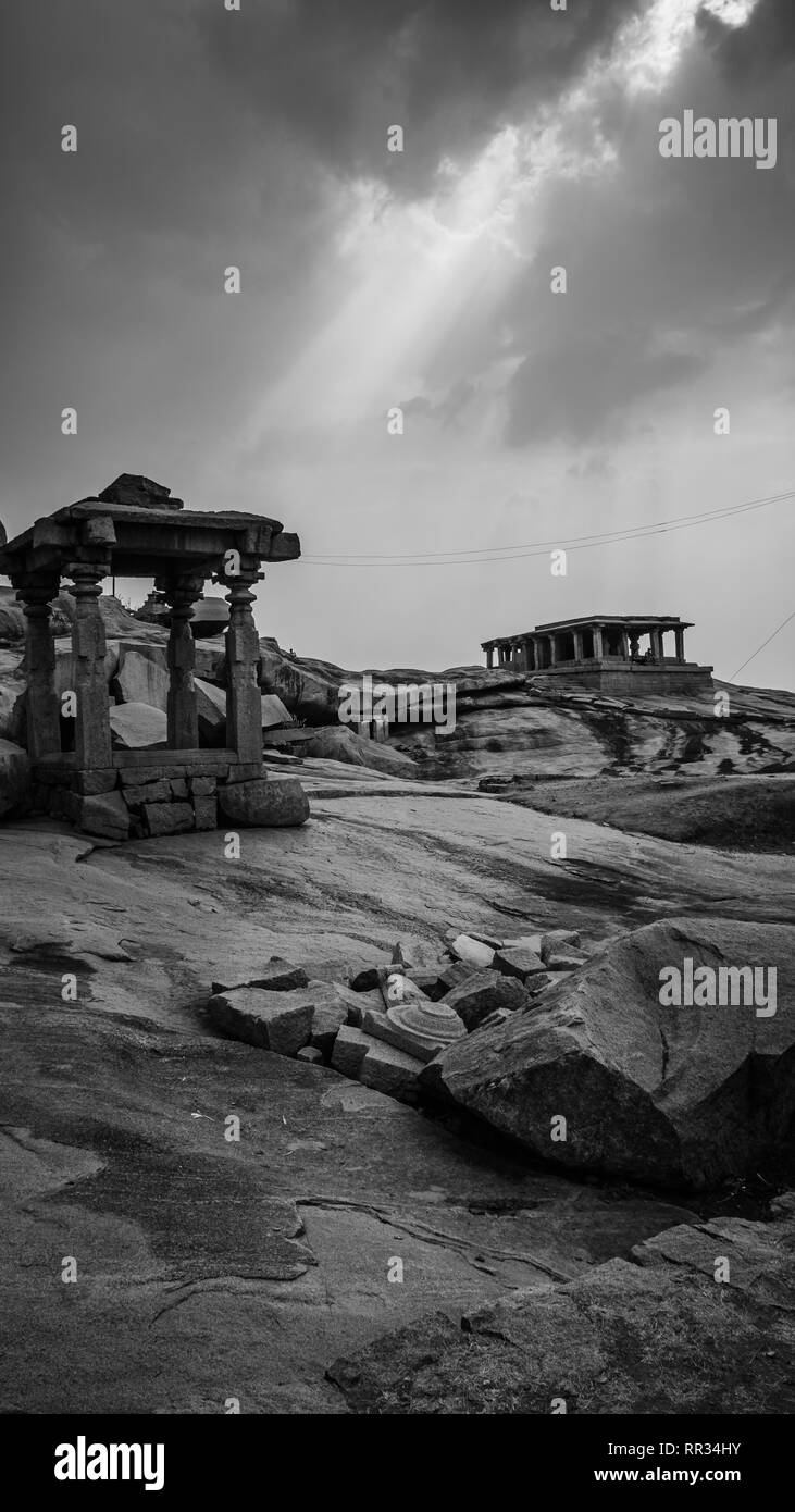 little stone temple with dramatic mystic sky in hampi india karnakata ...
