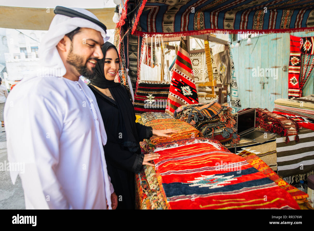 Arabian couple with traditional emirates dress dating outdoors - Happy ...