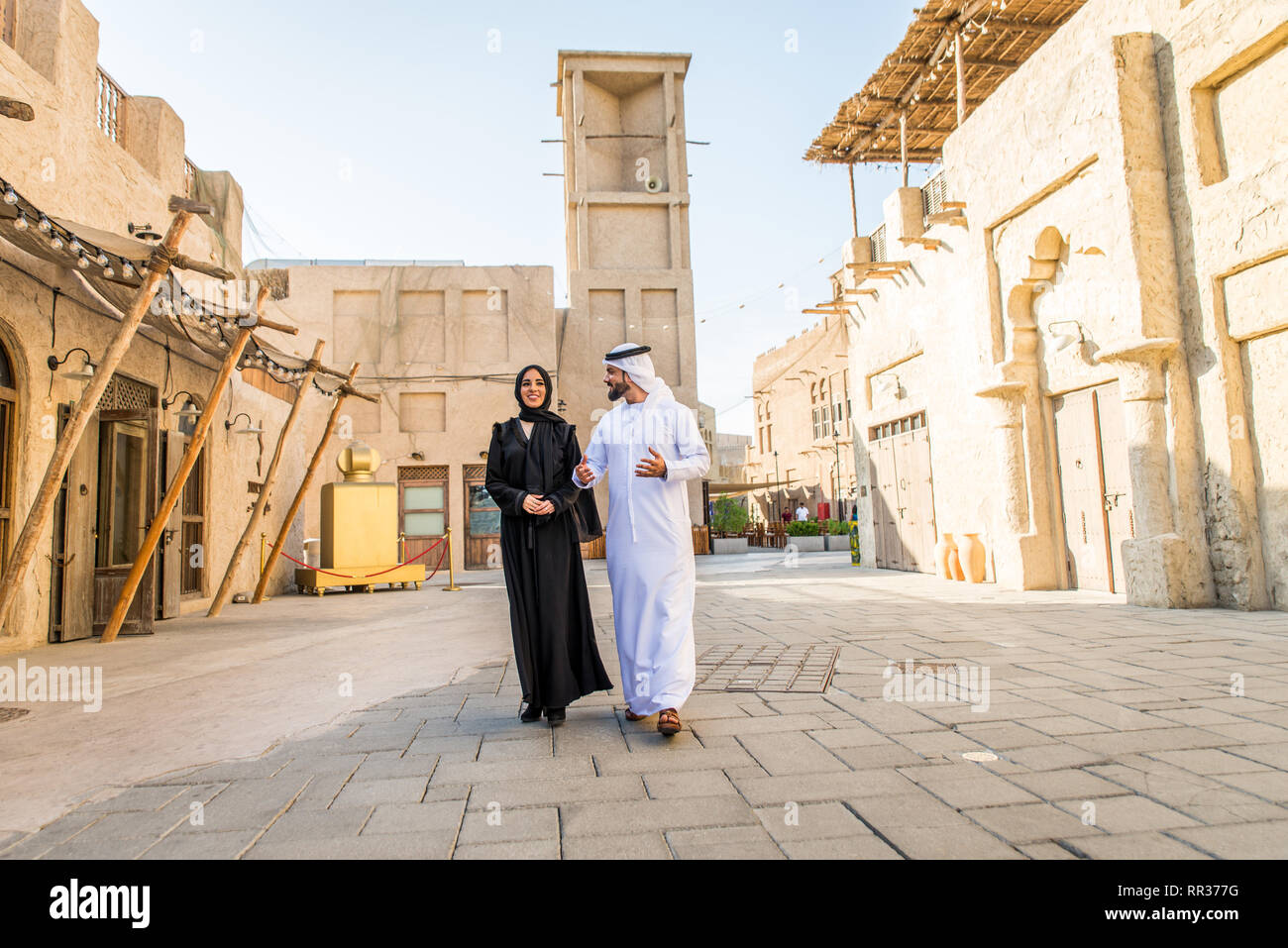 Arabian couple with traditional emirates dress dating outdoors - Happy ...