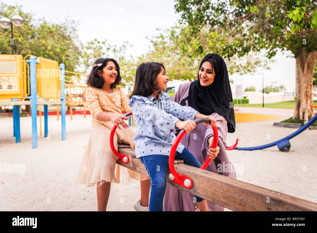 Happy arabian family having fun in Dubai - Mom together with her ...