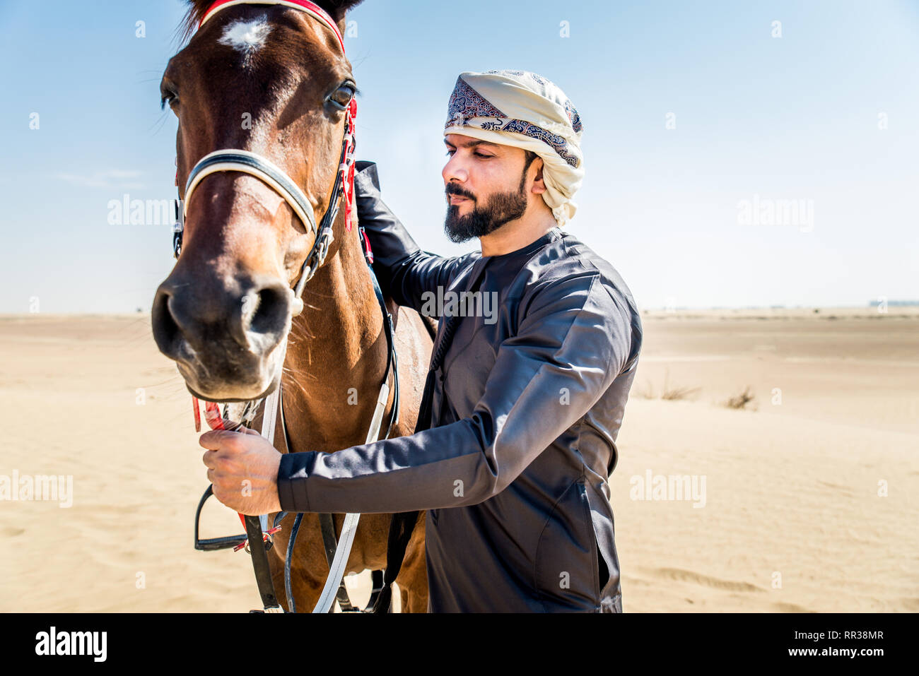 Arab man walk horse hi-res stock photography and images - Alamy